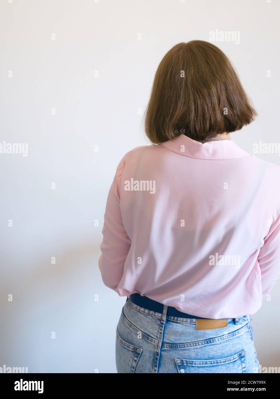 Young woman turned with her back Stock Photo - Alamy