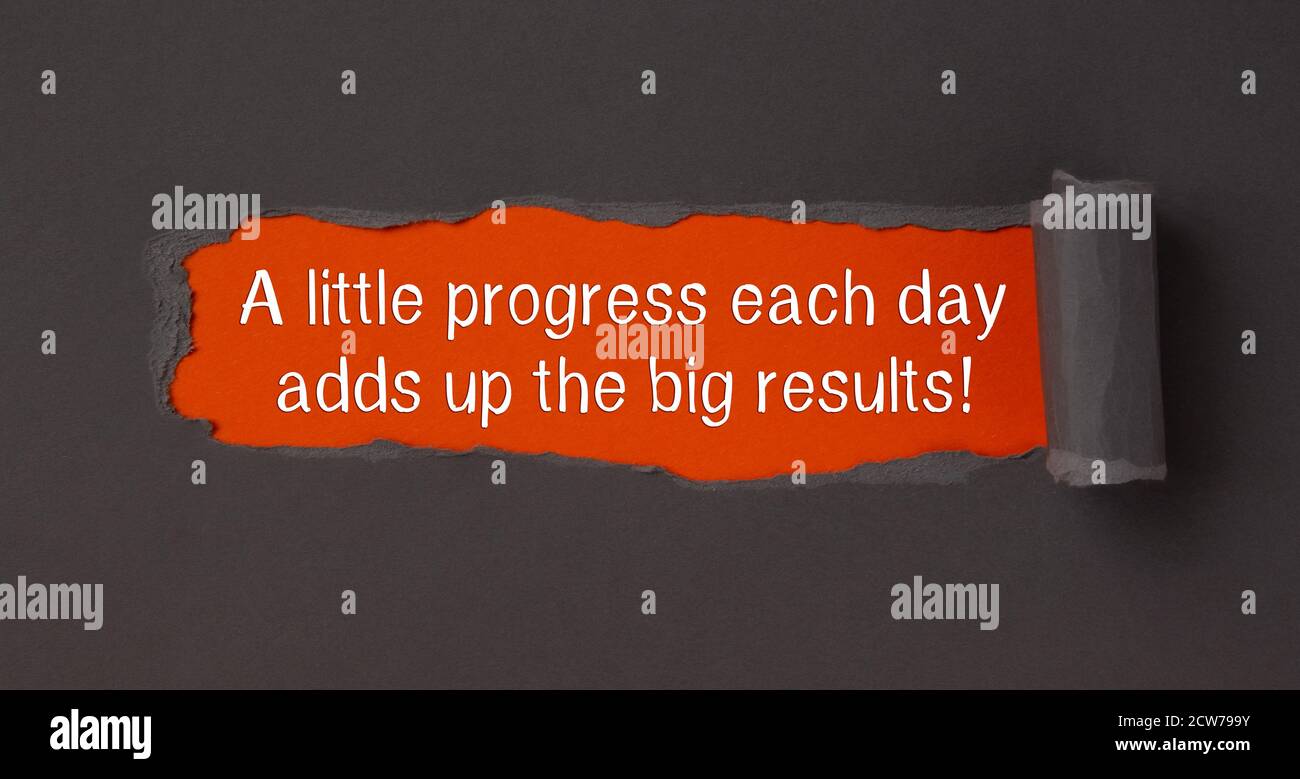 A little progress each day adds up the big results - text behind torn ...