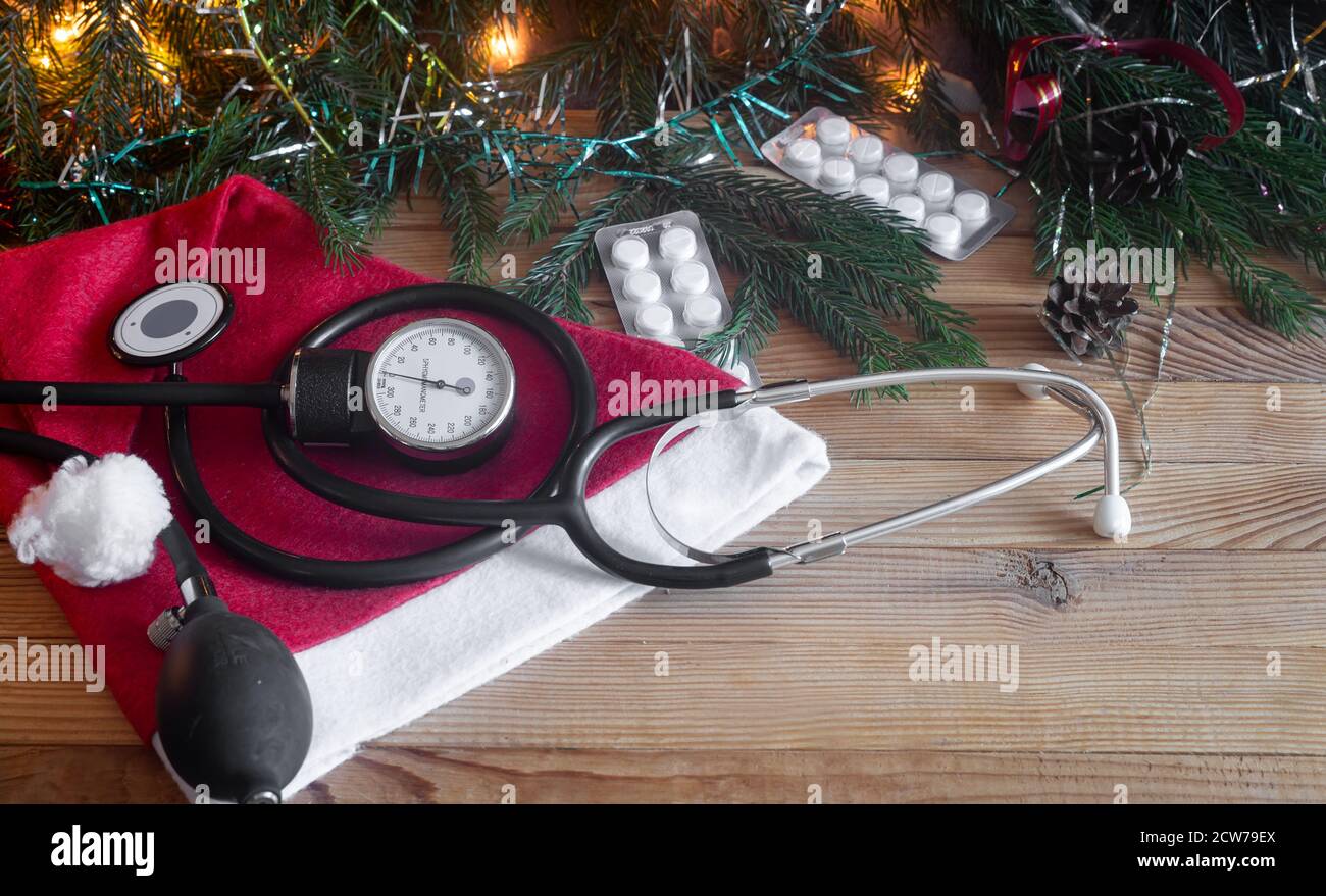 Christmas in medicine: stethoscope, pills and Christmas decorations ...