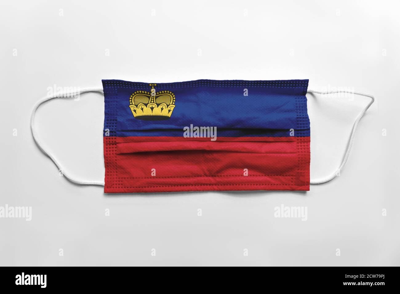 Face mask with Liechtenstein flag printed, on white background ...