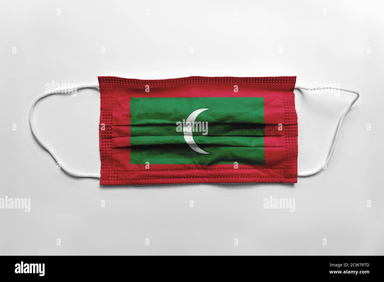 Face mask with Maldives flag printed, on white background, isolated ...