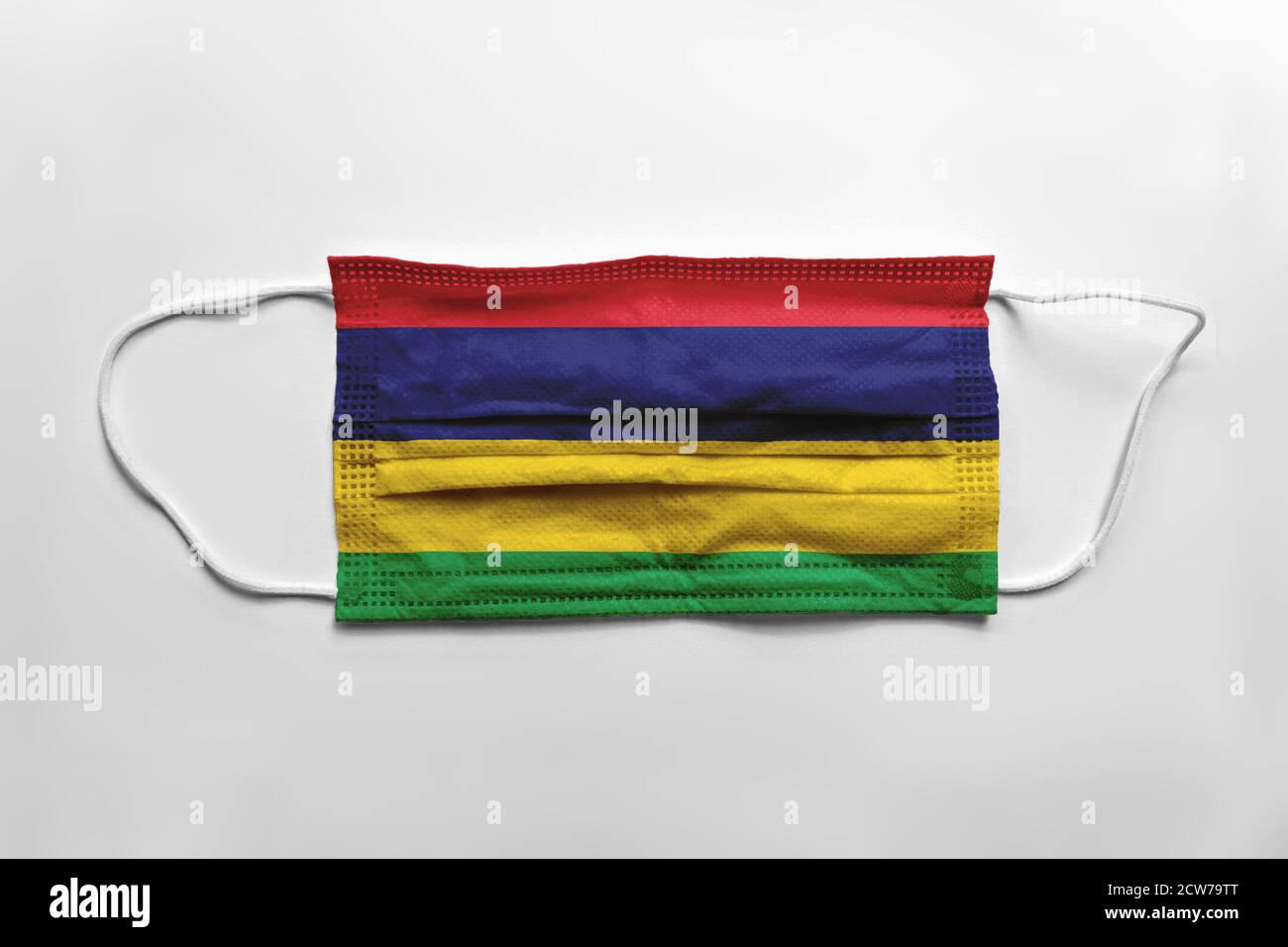 Face mask with Mauritius flag printed, on white background, isolated ...