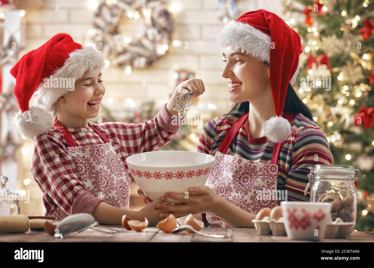Merry Christmas and Happy Holidays. Family preparation holiday food ...