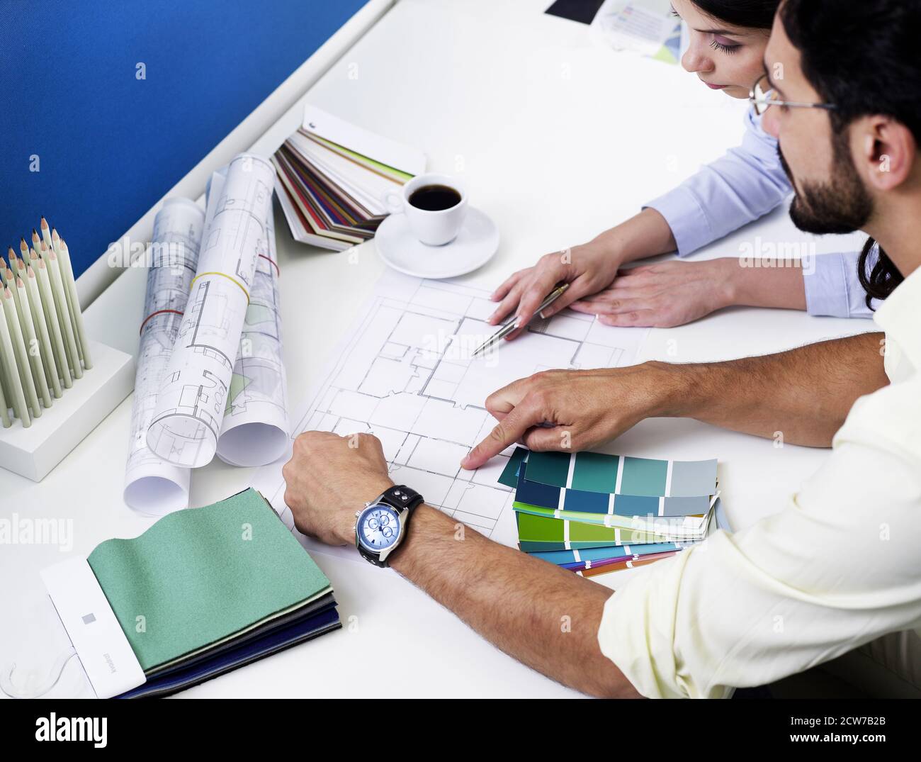 People discussing over blueprints Stock Photo - Alamy