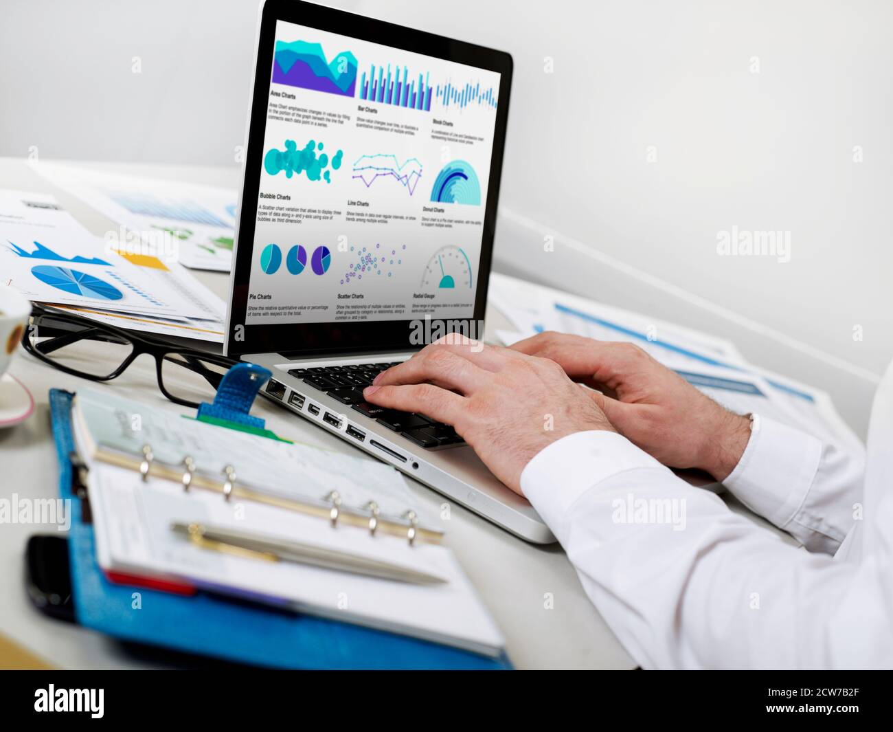 Businessman working on graphs hi-res stock photography and images - Alamy
