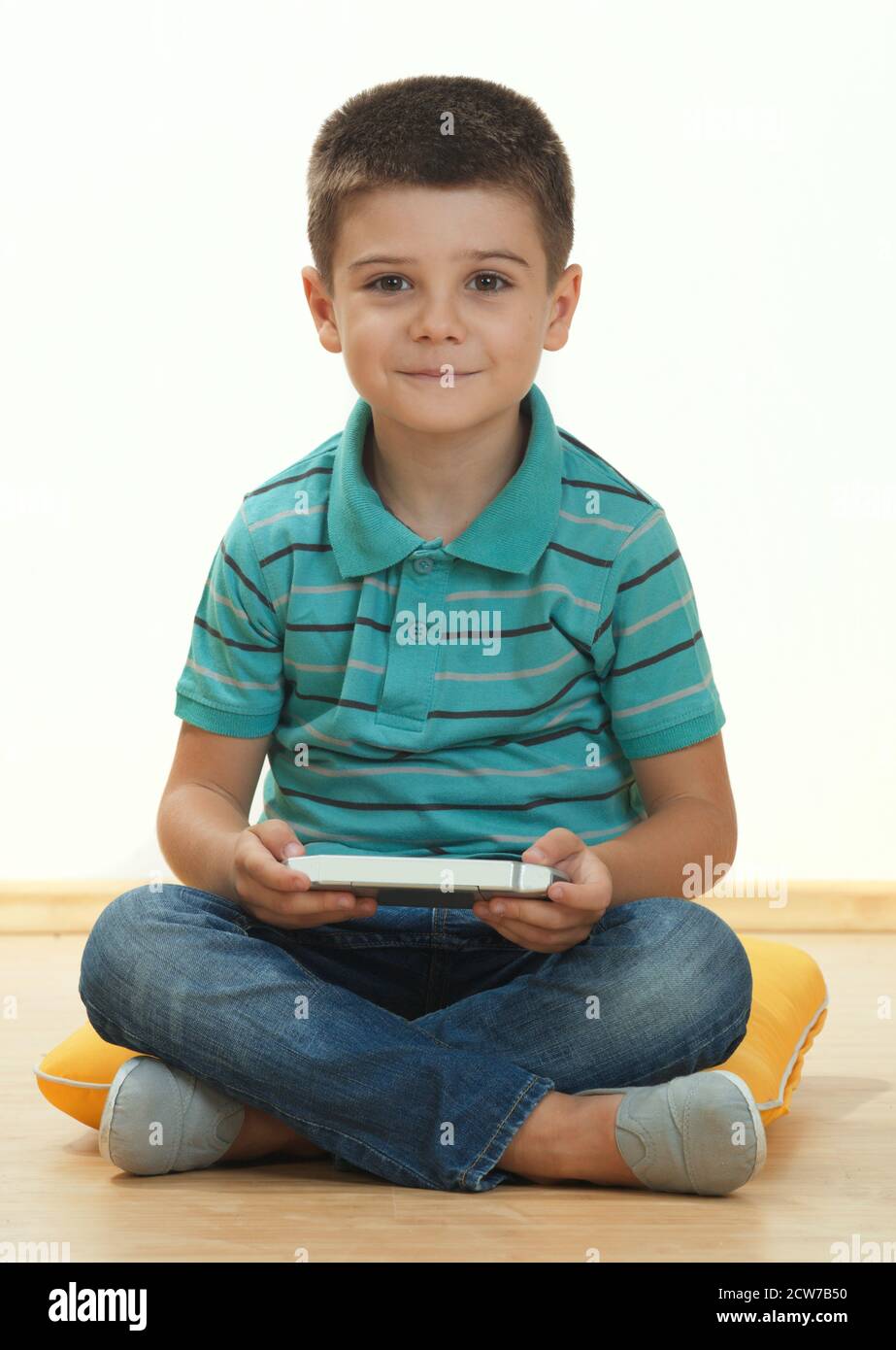 Young boy with game pad Stock Photo - Alamy