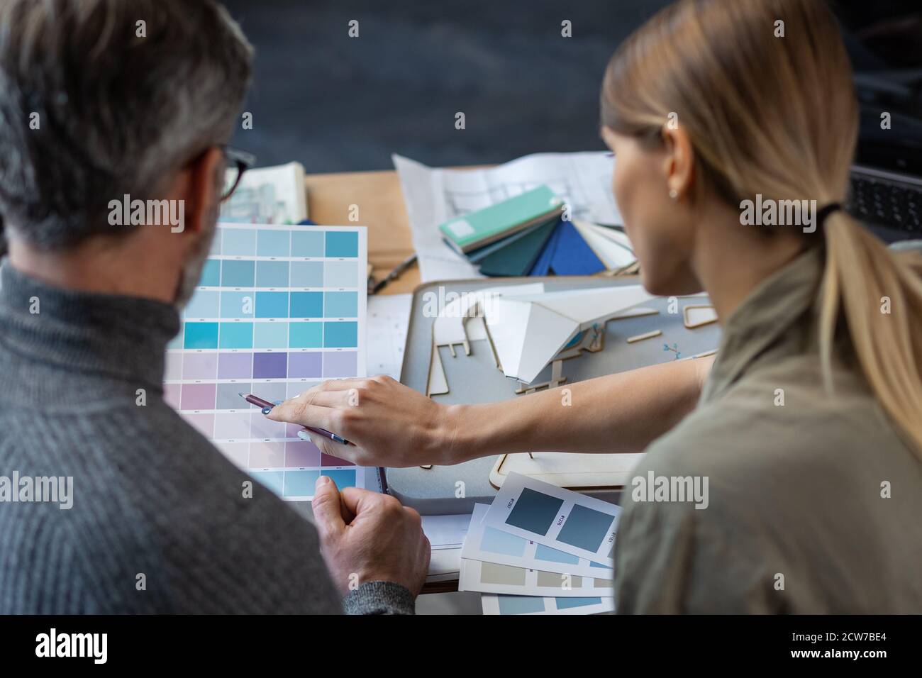 Interior designers team working in office with color palette ...