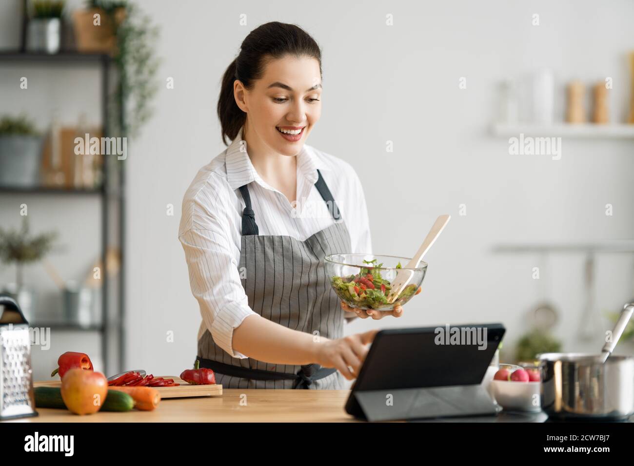 Healthy Food At Home Happy Woman Is Preparing The Proper Meal In The