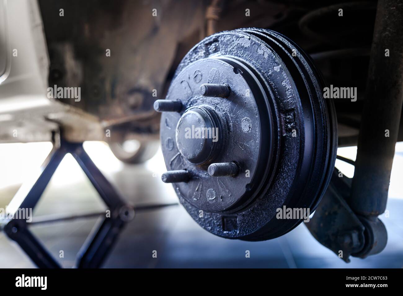 A rear hub of the car after removing a tire and wheel, maintaining a ...
