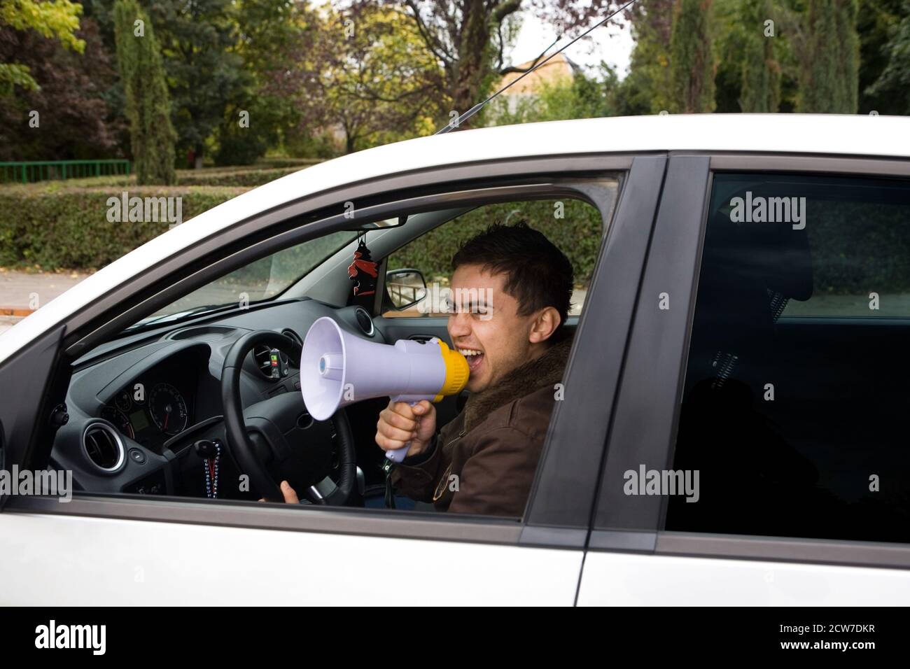 Angry driver with megaphone Stock Photo - Alamy