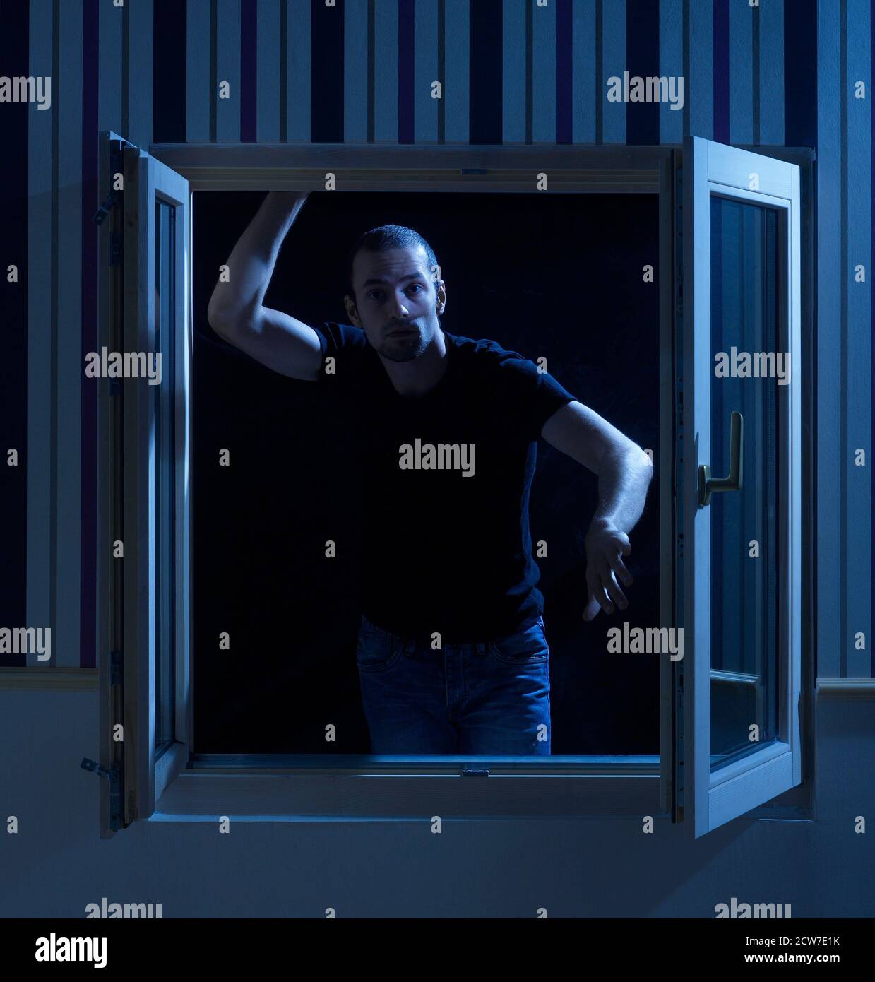Burglar looking through window hi-res stock photography and images - Alamy