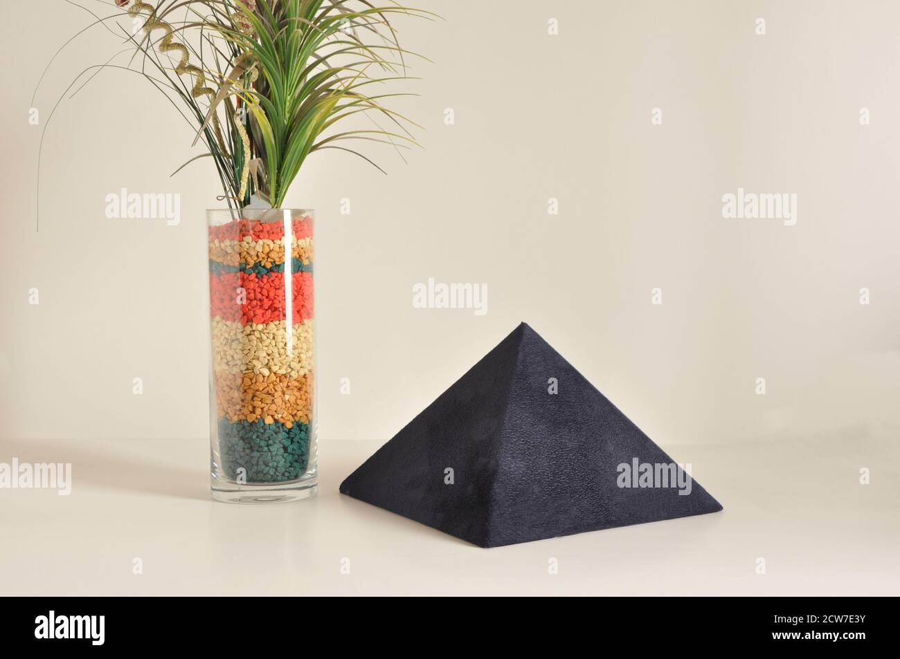 Blue felt pyramid. pyramid with glass vase and decoration with ...