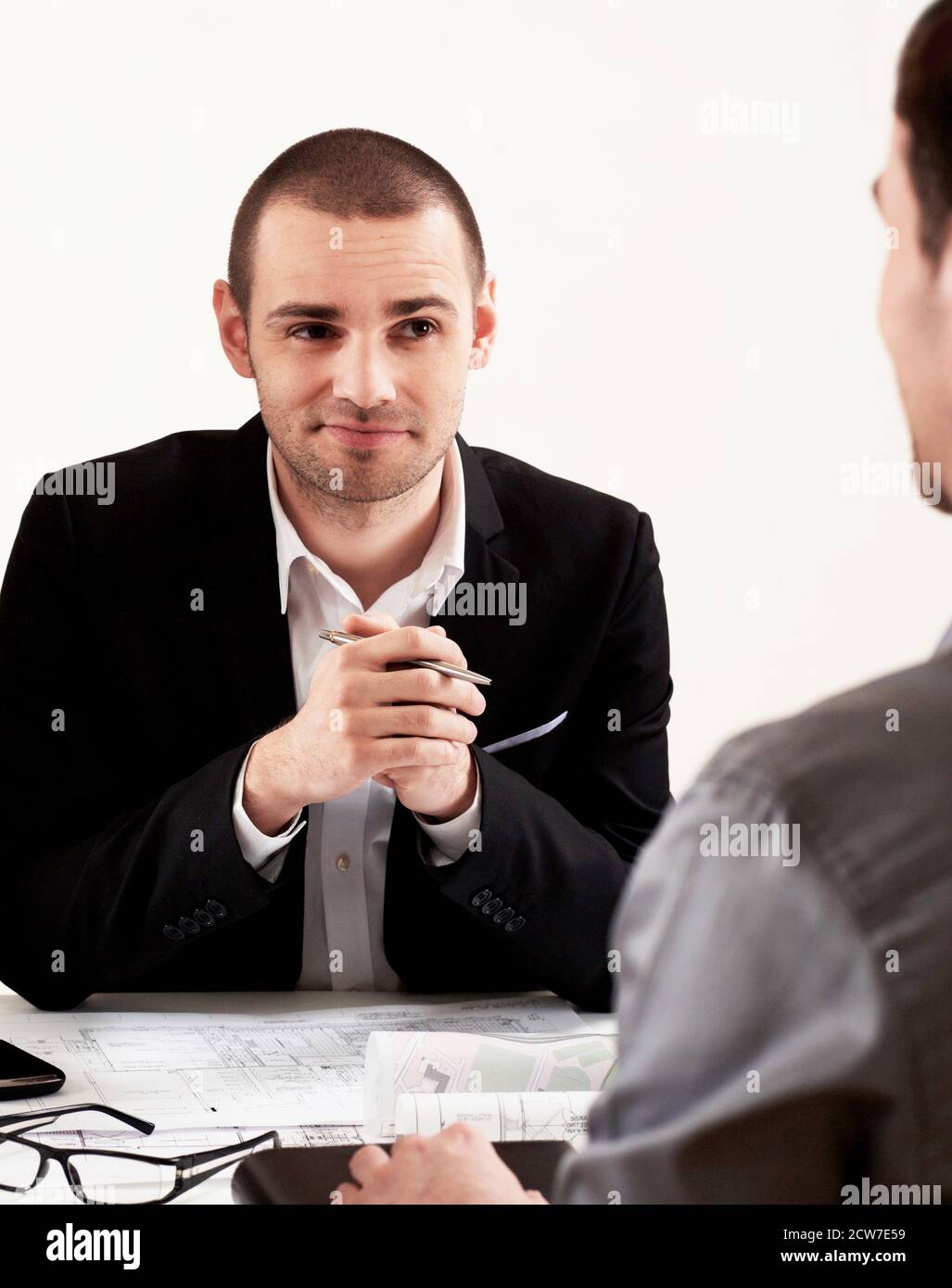Businessmen in discussion Stock Photo - Alamy