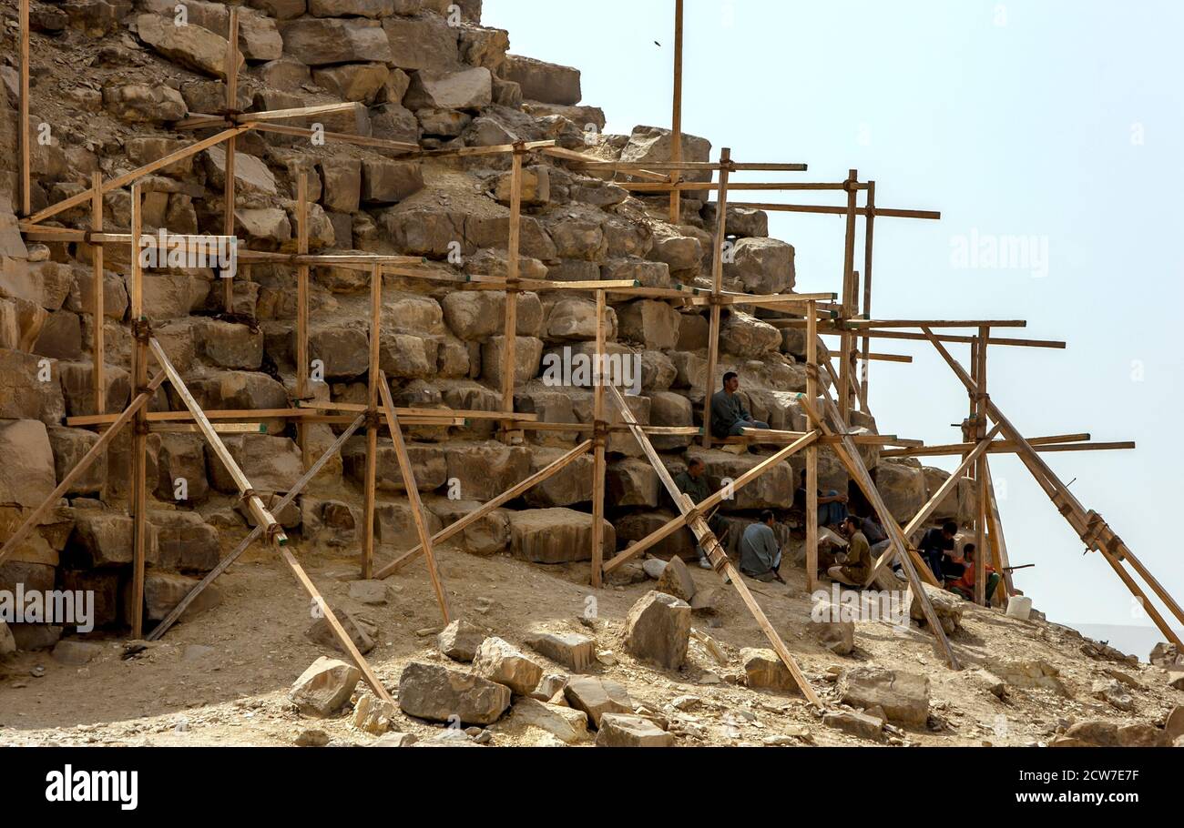 Egyptian workers take a rest from repairing a section of the Bent ...