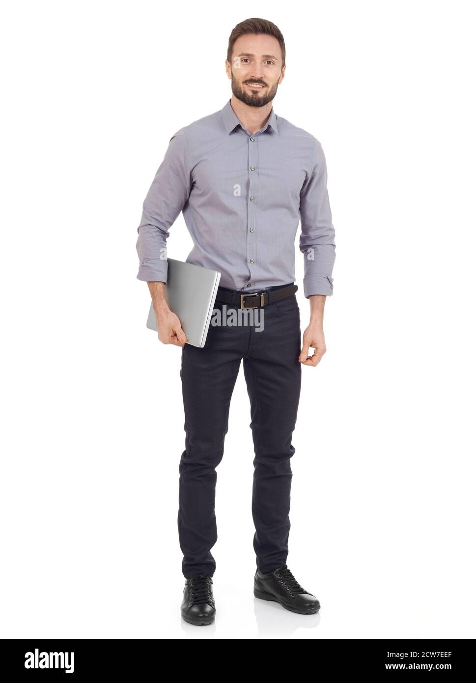 Cheerful man with a laptop, white background Stock Photo - Alamy