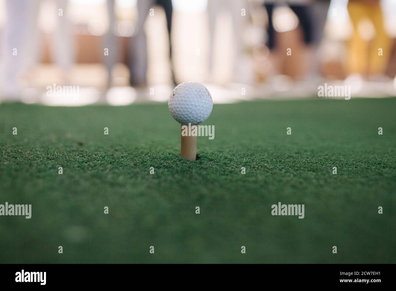 Golf ball on tee ready to be shot Stock Photo - Alamy