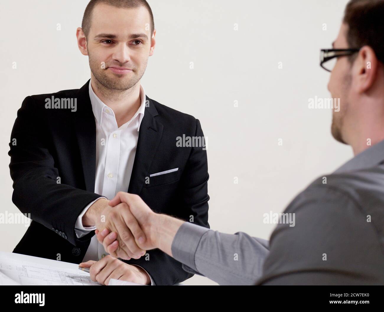 Business men handshake Stock Photo - Alamy