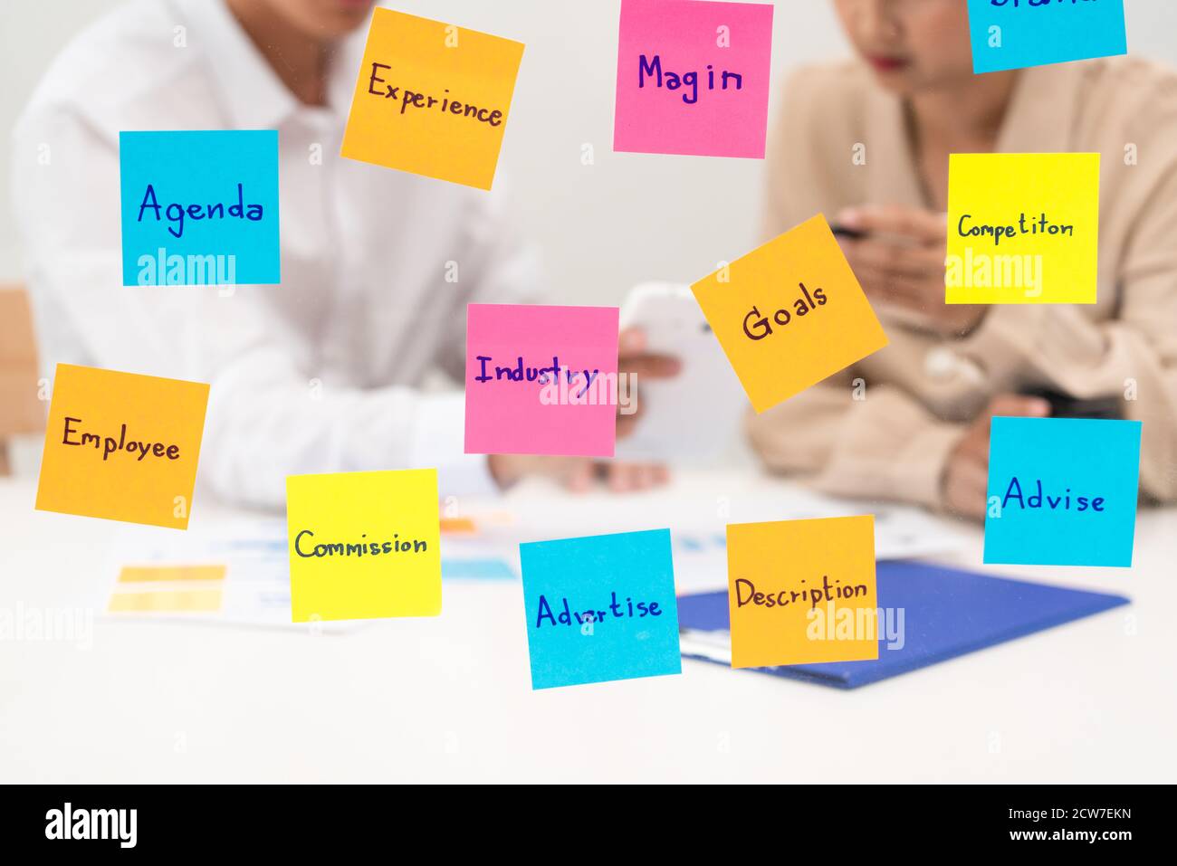 business people planning startup project placing sticky notes session ...