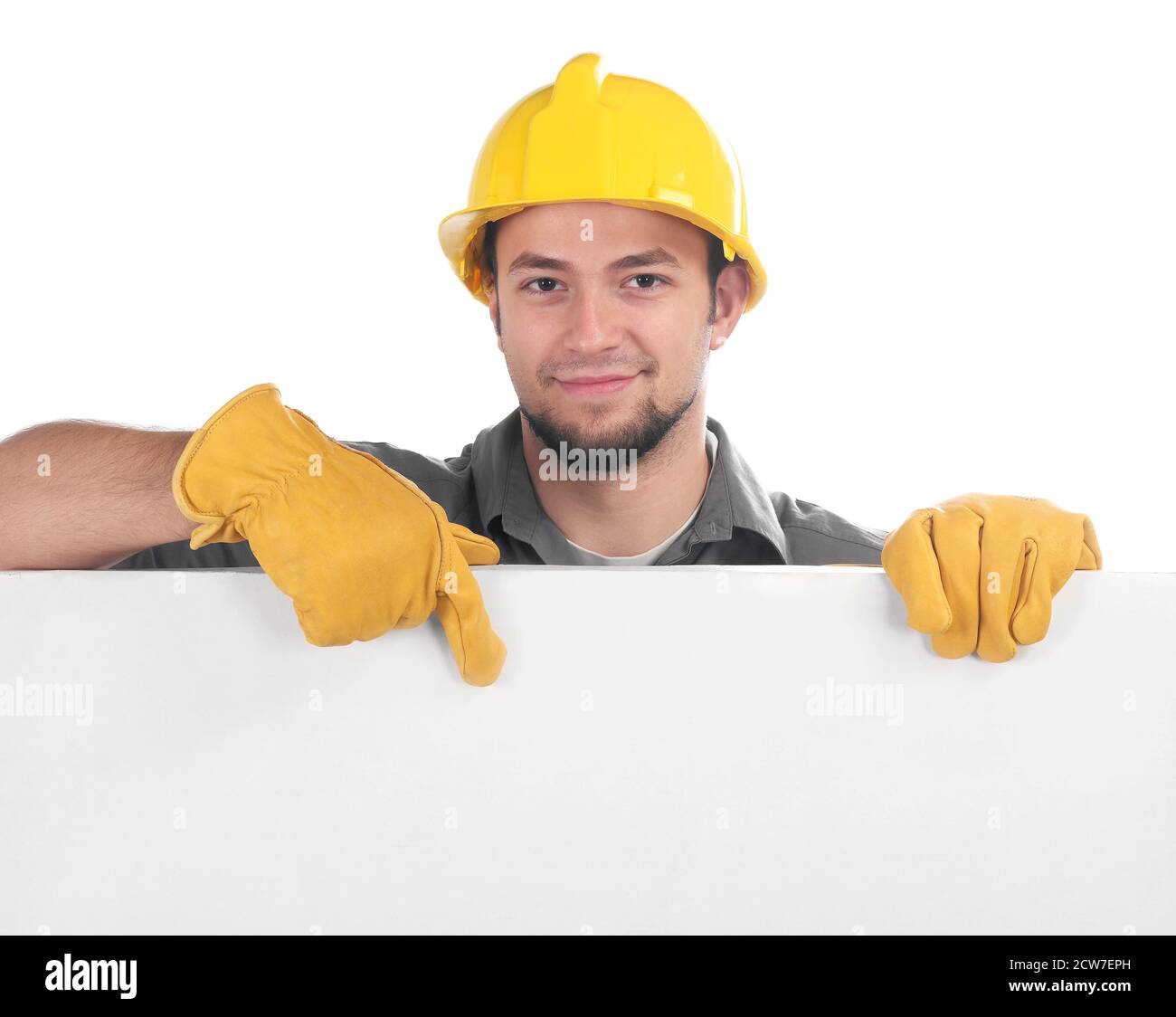 Carpenter pointing to a blank sign Stock Photo - Alamy