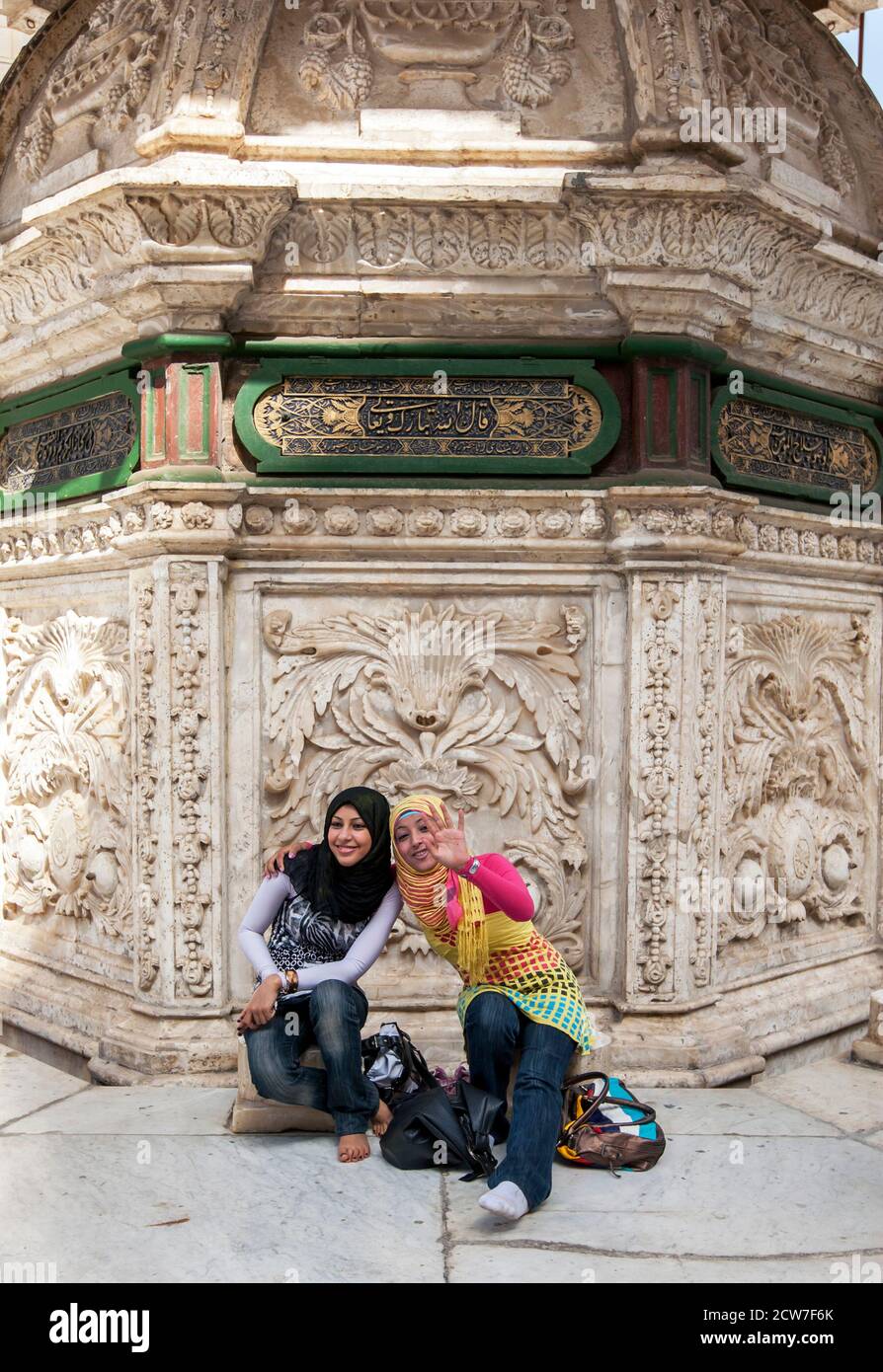 Egyptian girls pose for a photograph in the courtyard of the ...