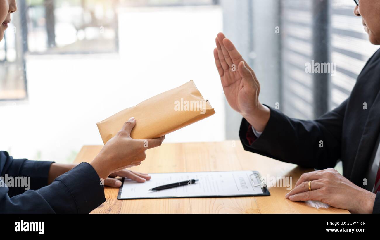 Confident businessman manager rejecting an offer of money to agreement ...