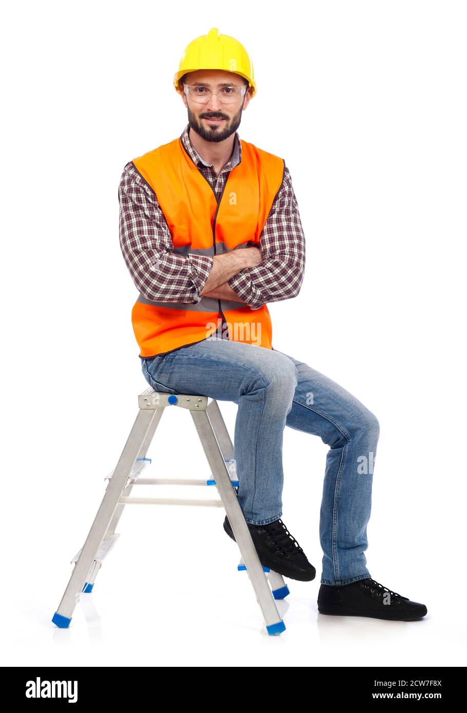 Carpenter sitting on a ladder and looking at camera, white background ...