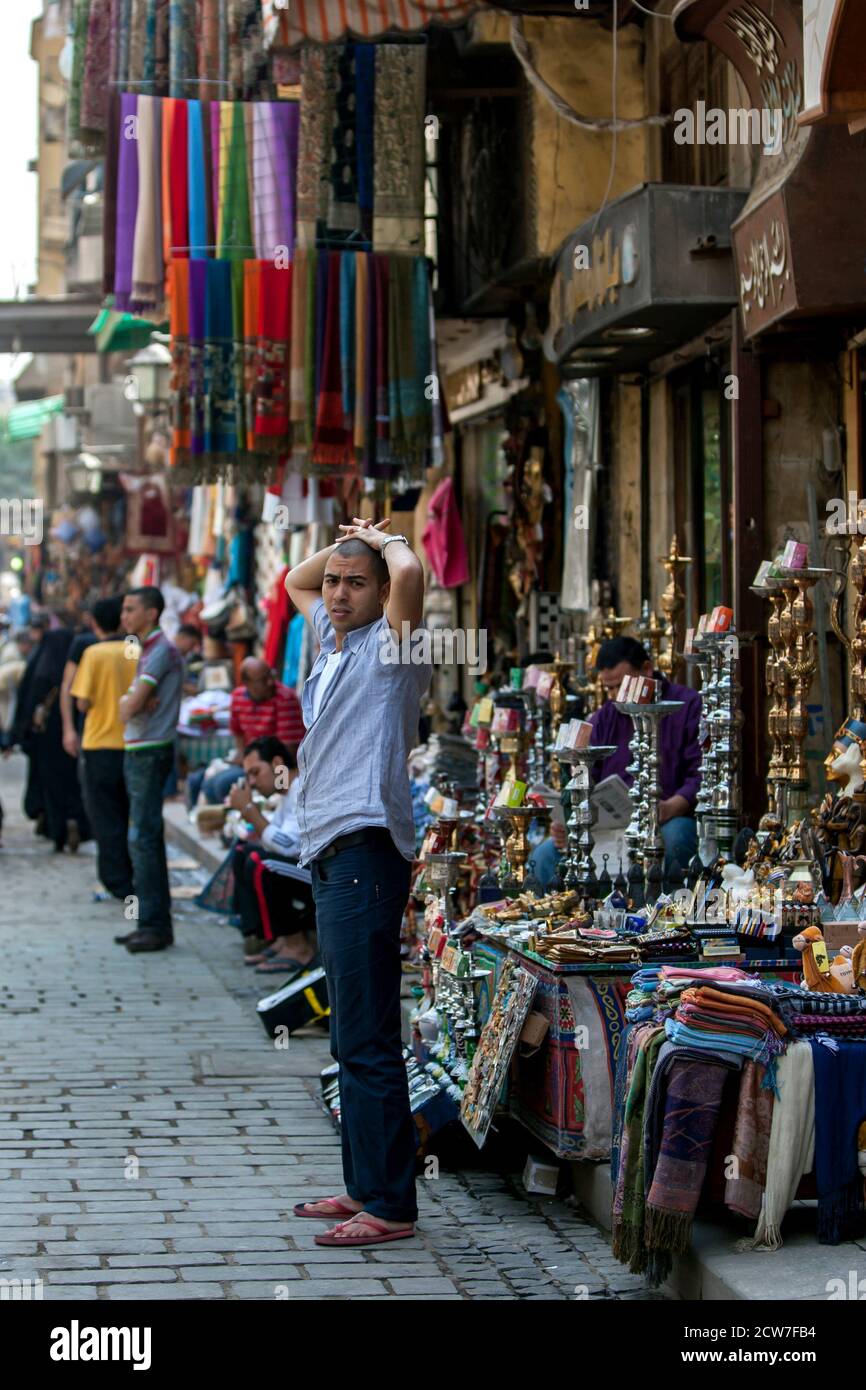 An Egyptian man stands outside his souvenir shop in the Khan el Khal ...