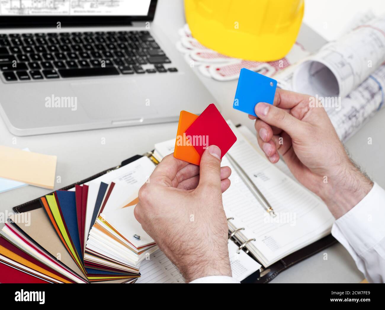 Man with color swatches at desk Stock Photo - Alamy