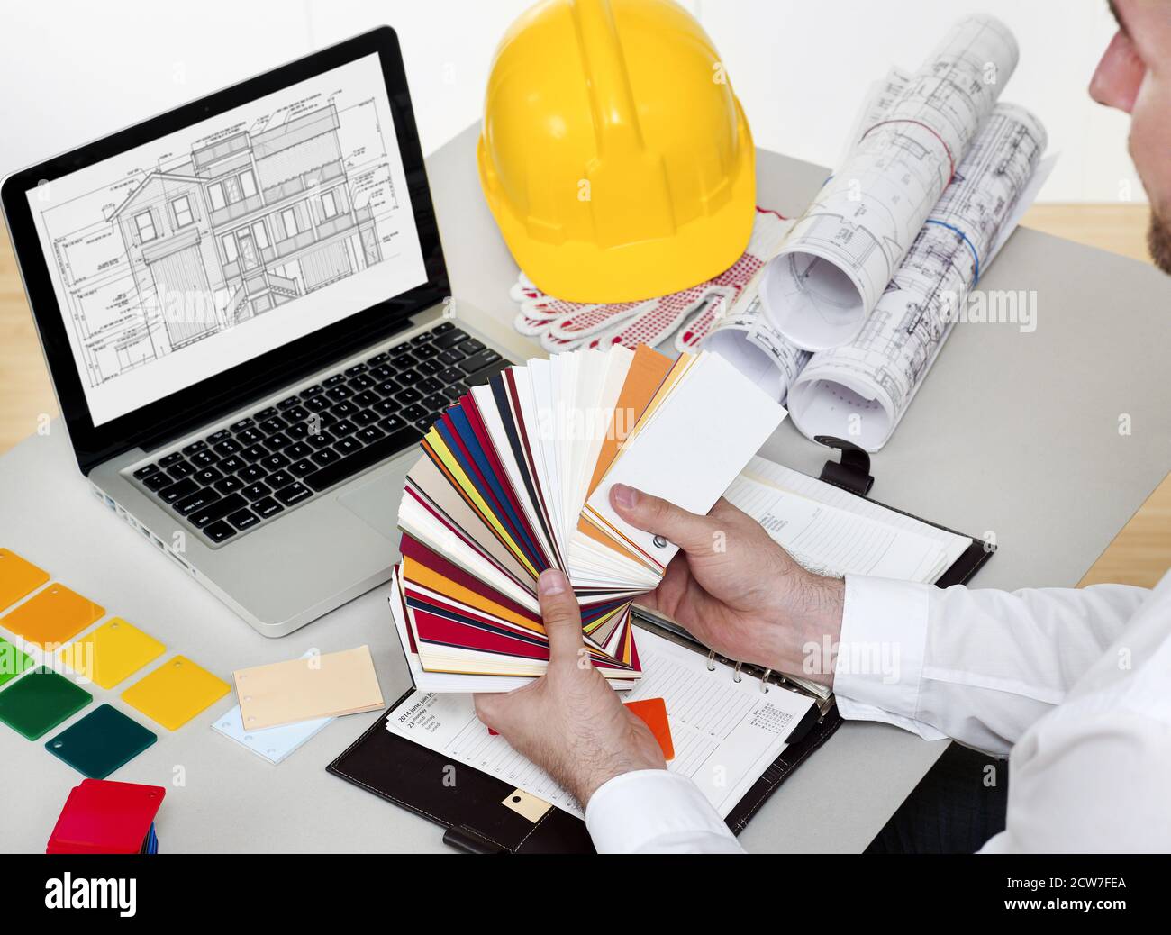 Building contractor with color swatch Stock Photo - Alamy