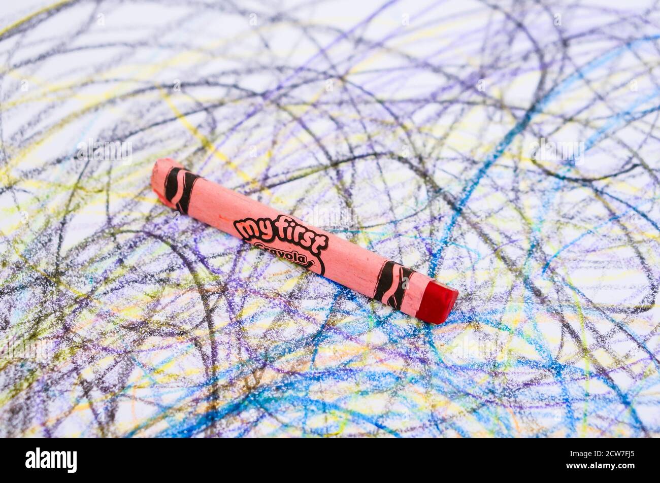 POZNAN, POLAND - May 14, 2016: Red Crayon drawing stick on a white ...