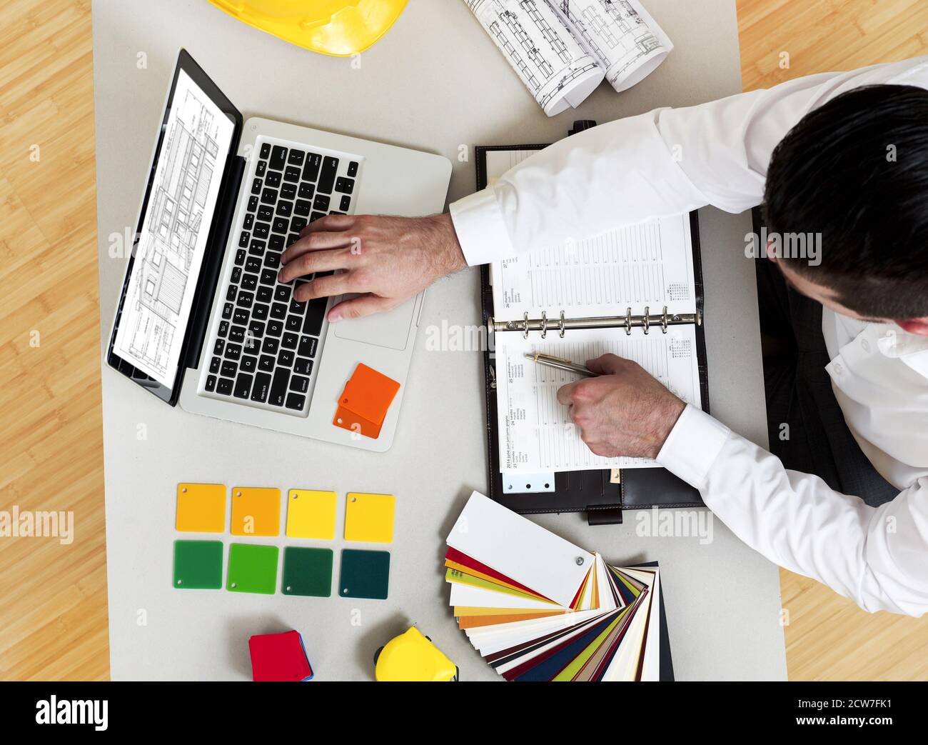Construction engineer choosing the color Stock Photo - Alamy