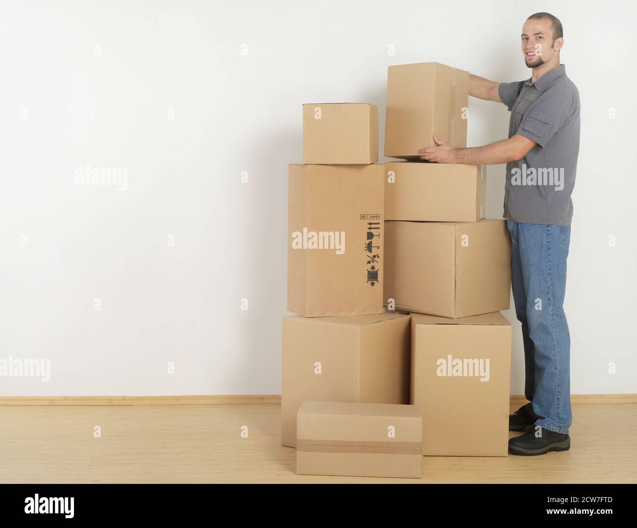 Delivery guy with boxes Stock Photo - Alamy