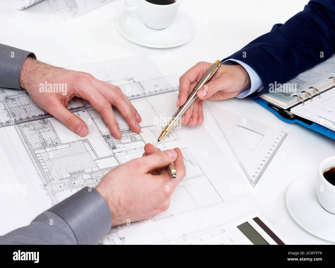 People working on blueprints Stock Photo - Alamy