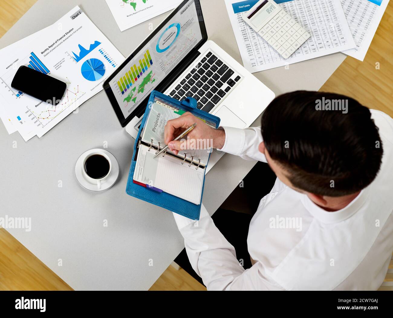 Man working on financial data Stock Photo - Alamy