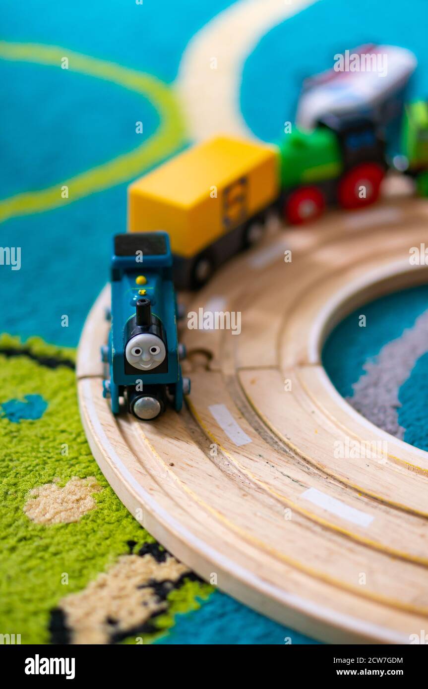 POZNAN, POLAND - Sep 12, 2020: Wooden colorful toy train on a track in ...