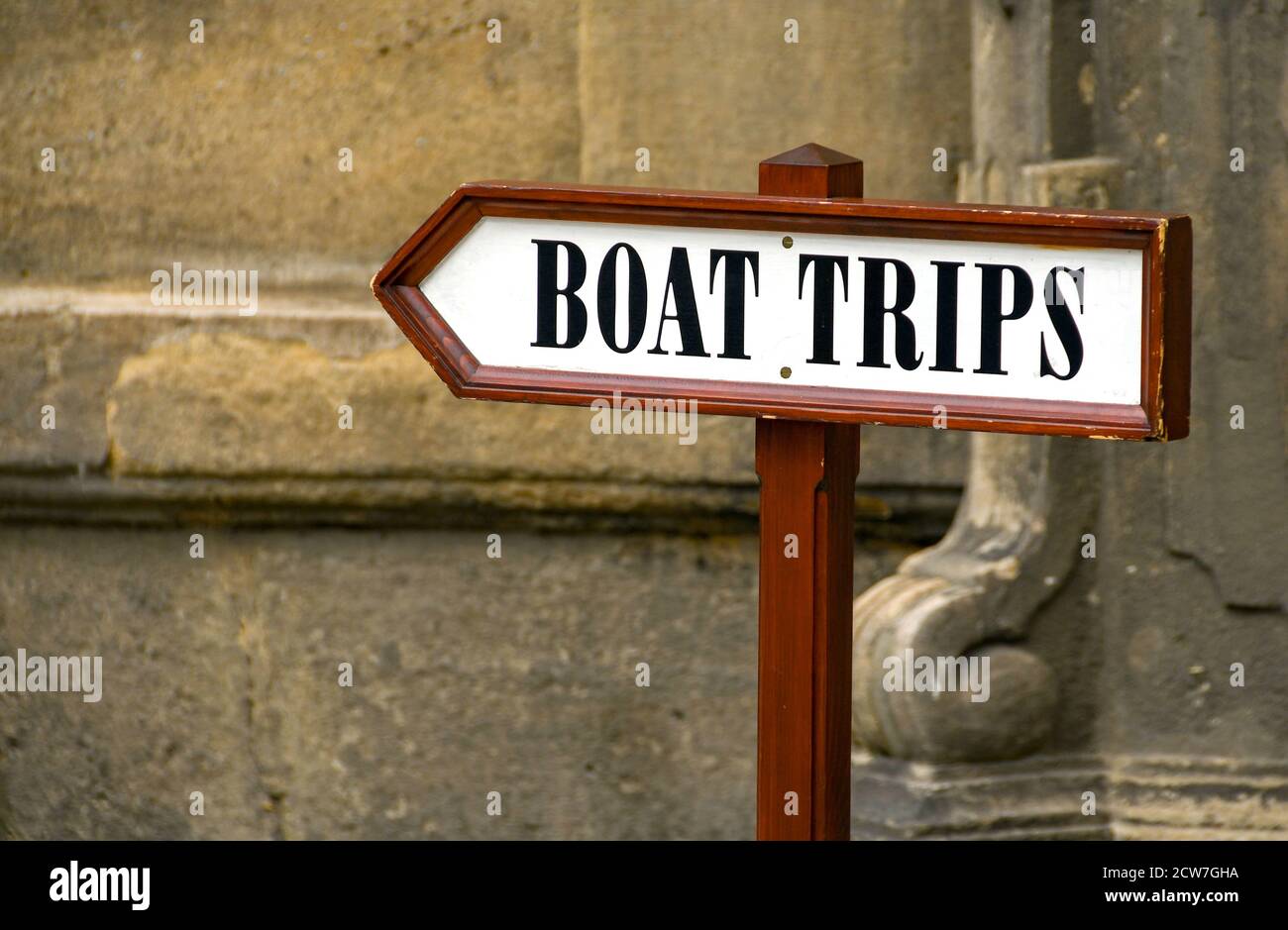 Close up of a tourist information sign pointing the way for boat trips ...