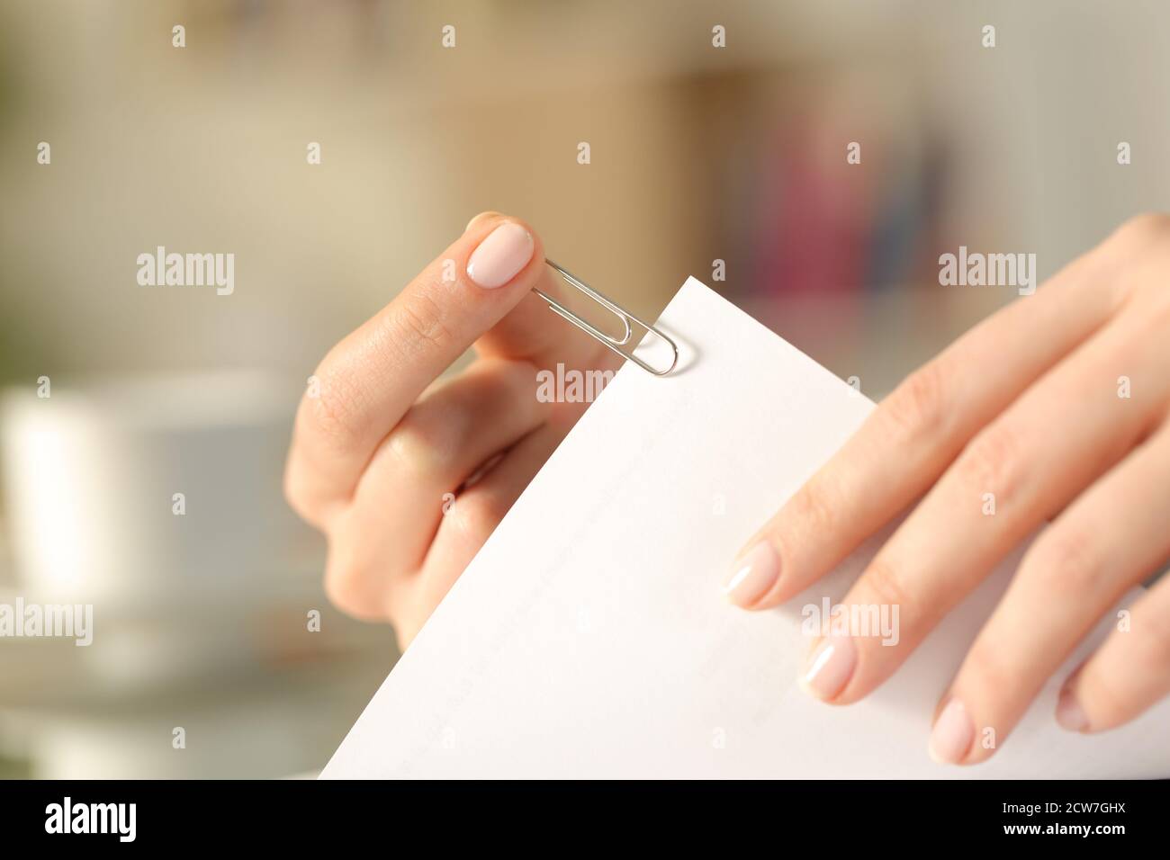 Paperclip holding paper together hi-res stock photography and images ...