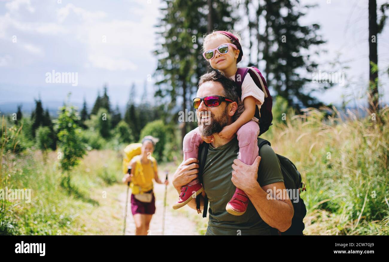 Family with small child hiking outdoors in summer nature Stock Photo ...
