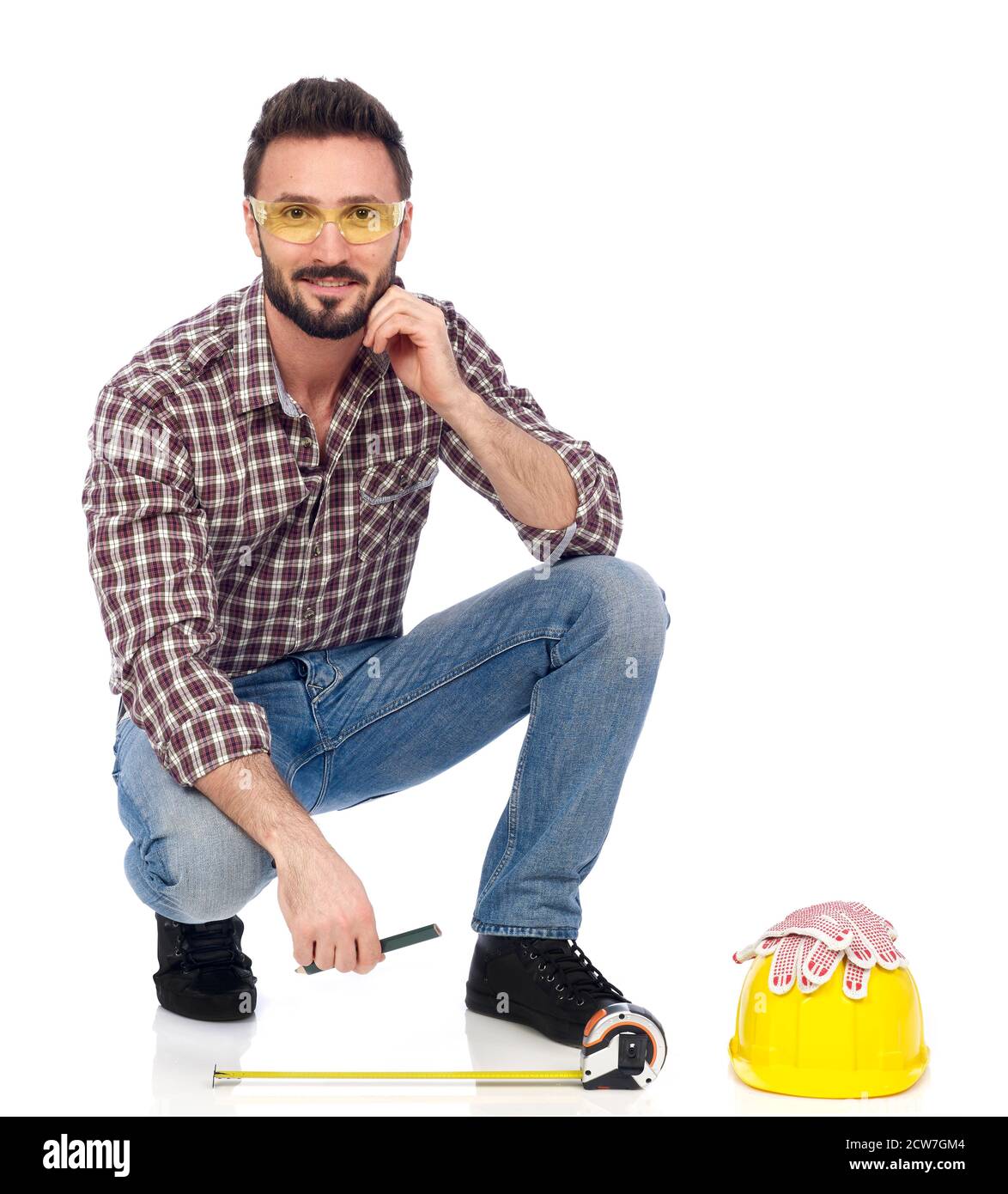 Cheerful carpenter looking at camera, white background Stock Photo - Alamy