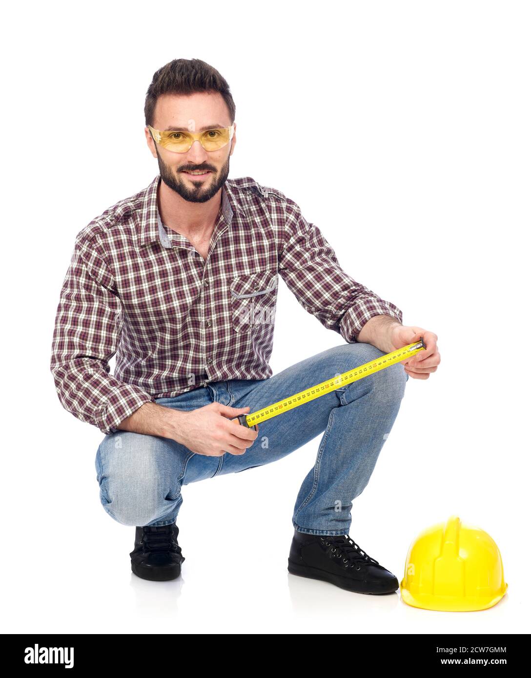 Cheerful carpenter looking at camera, white background Stock Photo - Alamy