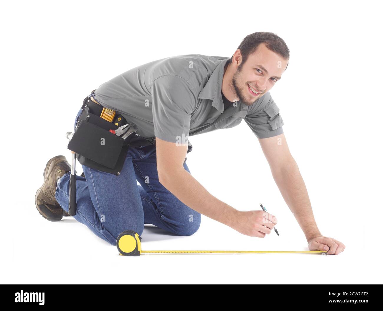 Handyman with tape measure Stock Photo - Alamy