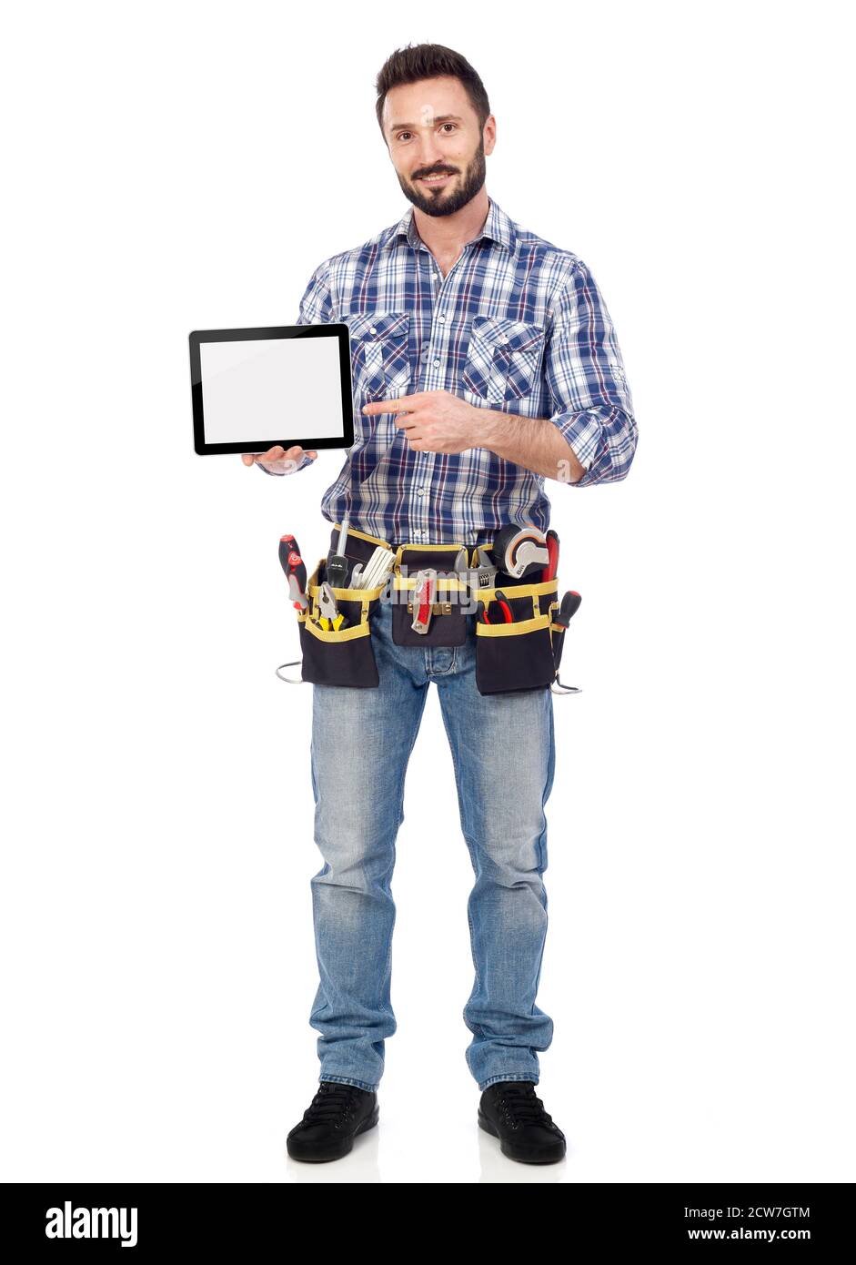 Smiling man tablet computer home Cut Out Stock Images & Pictures - Alamy