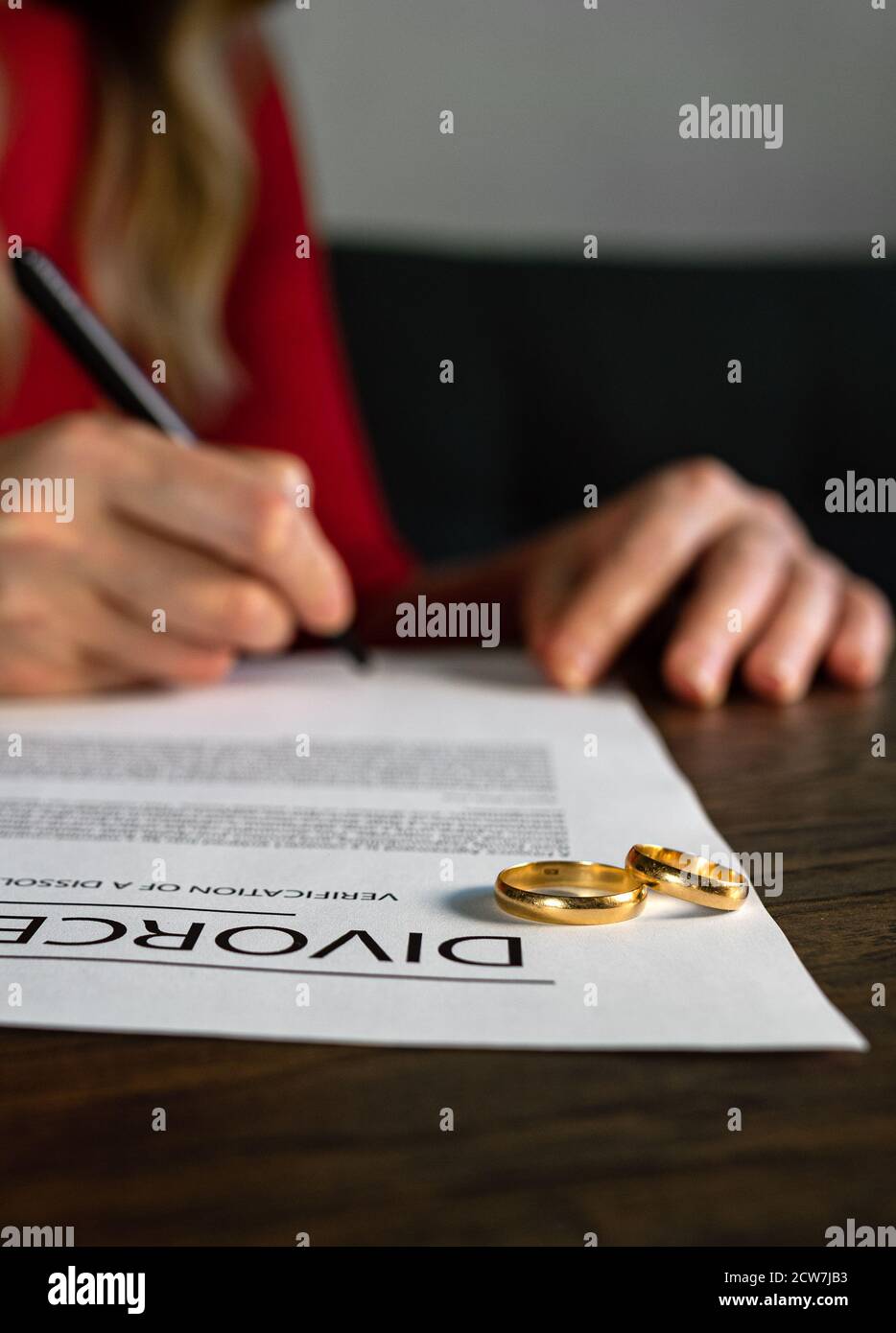 Wife signing decree of divorce agreement prepared by lawyer Stock Photo ...
