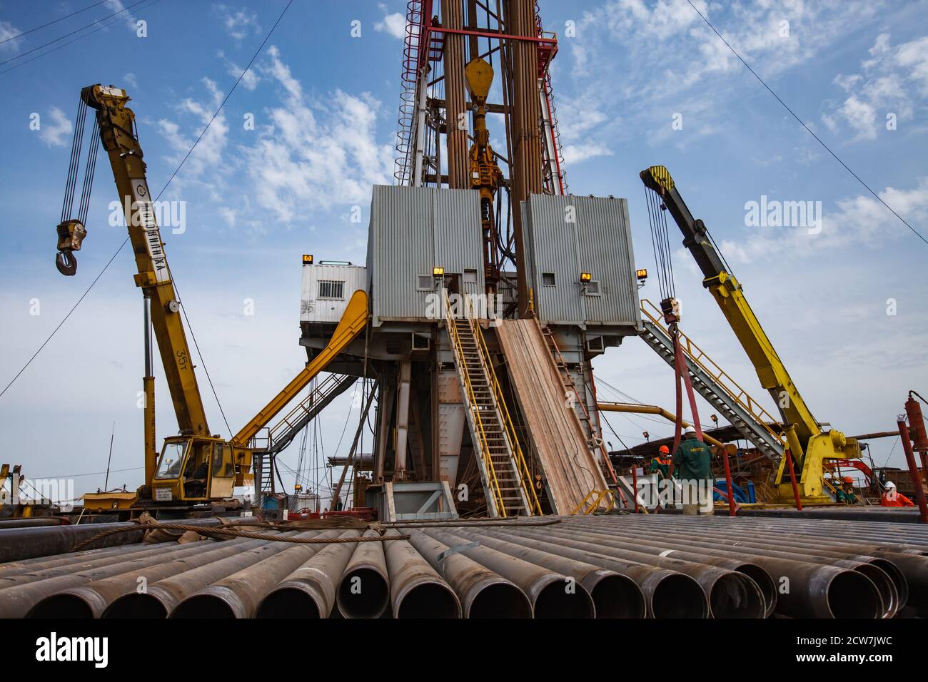 Zhaik-Munai oil deposit, Kazakhstan. Oil drilling rig, drilling pipes ...