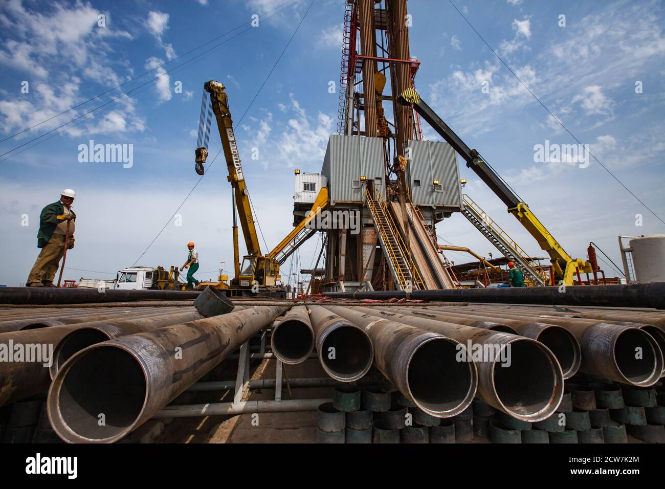 Zhaik-Munai oil deposit, Kazakhstan. Oil drilling rig, cranes, drilling ...
