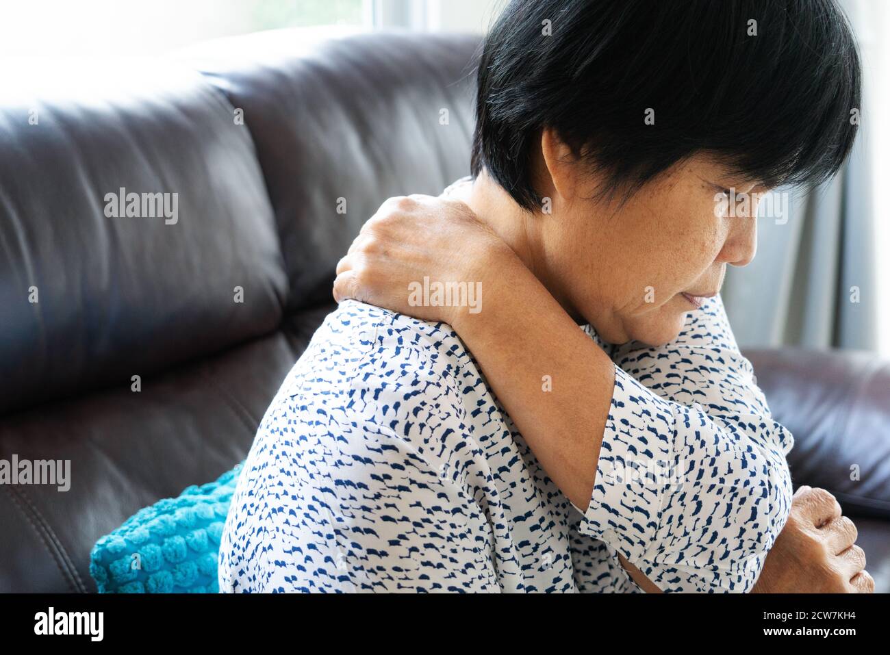 old woman suffering from neck pain, closeup, health problem concept ...
