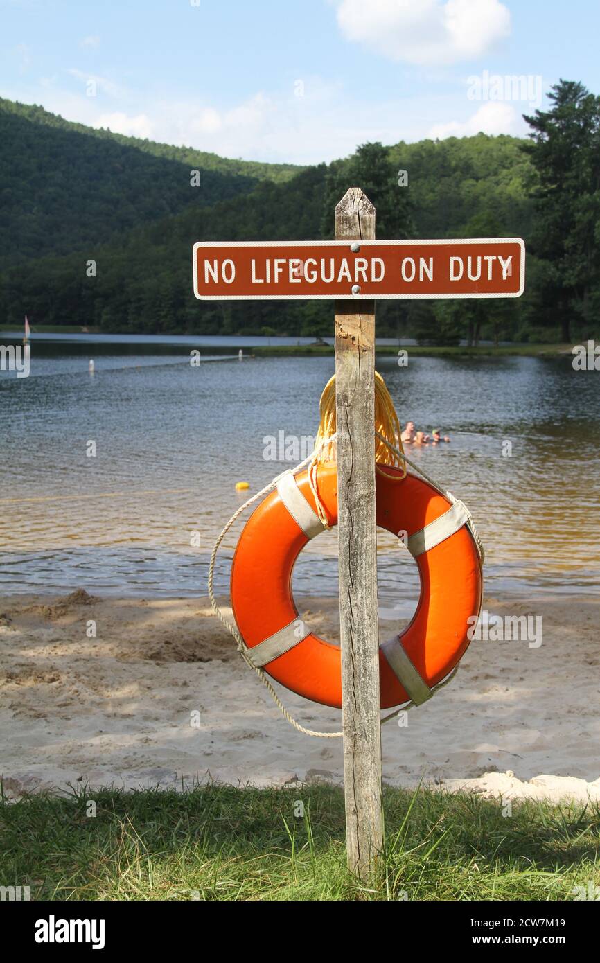 "No lifeguard on duty" sign by a lake Stock Photo - Alamy