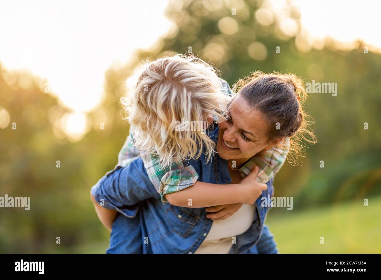 Mother and son having fun outdoors Stock Photo - Alamy