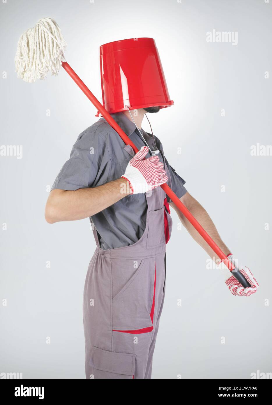 Janitor with bucket on his head Stock Photo - Alamy