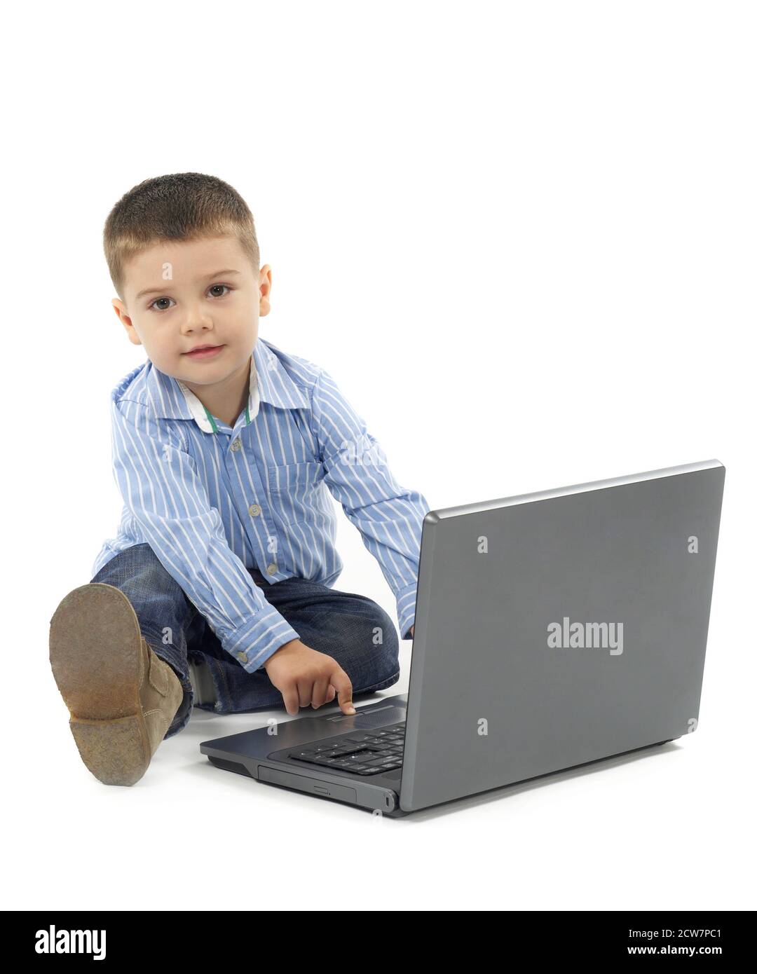 Smiling child laptop looking Cut Out Stock Images & Pictures - Alamy